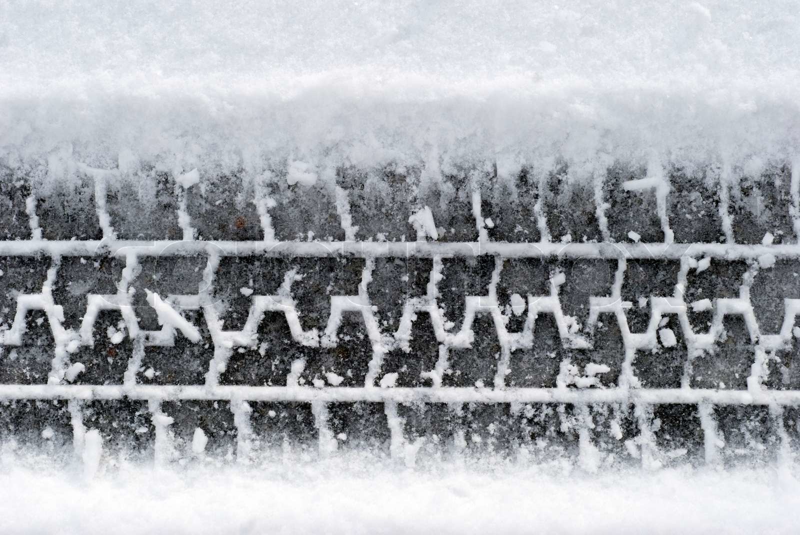 Close-up car tire tracks in the snow | Stock image | Colourbox