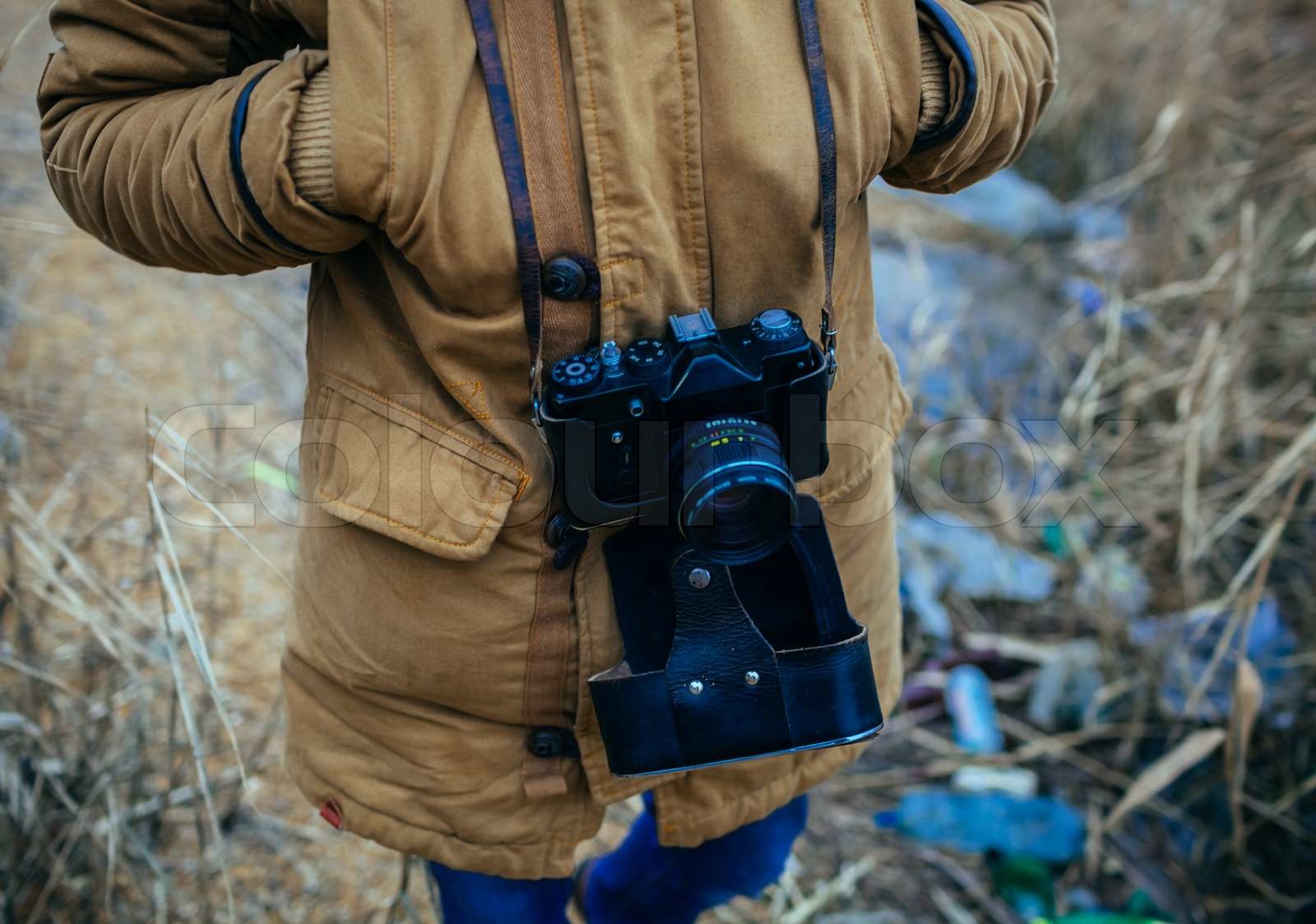 Man holding retro camera | Stock image | Colourbox