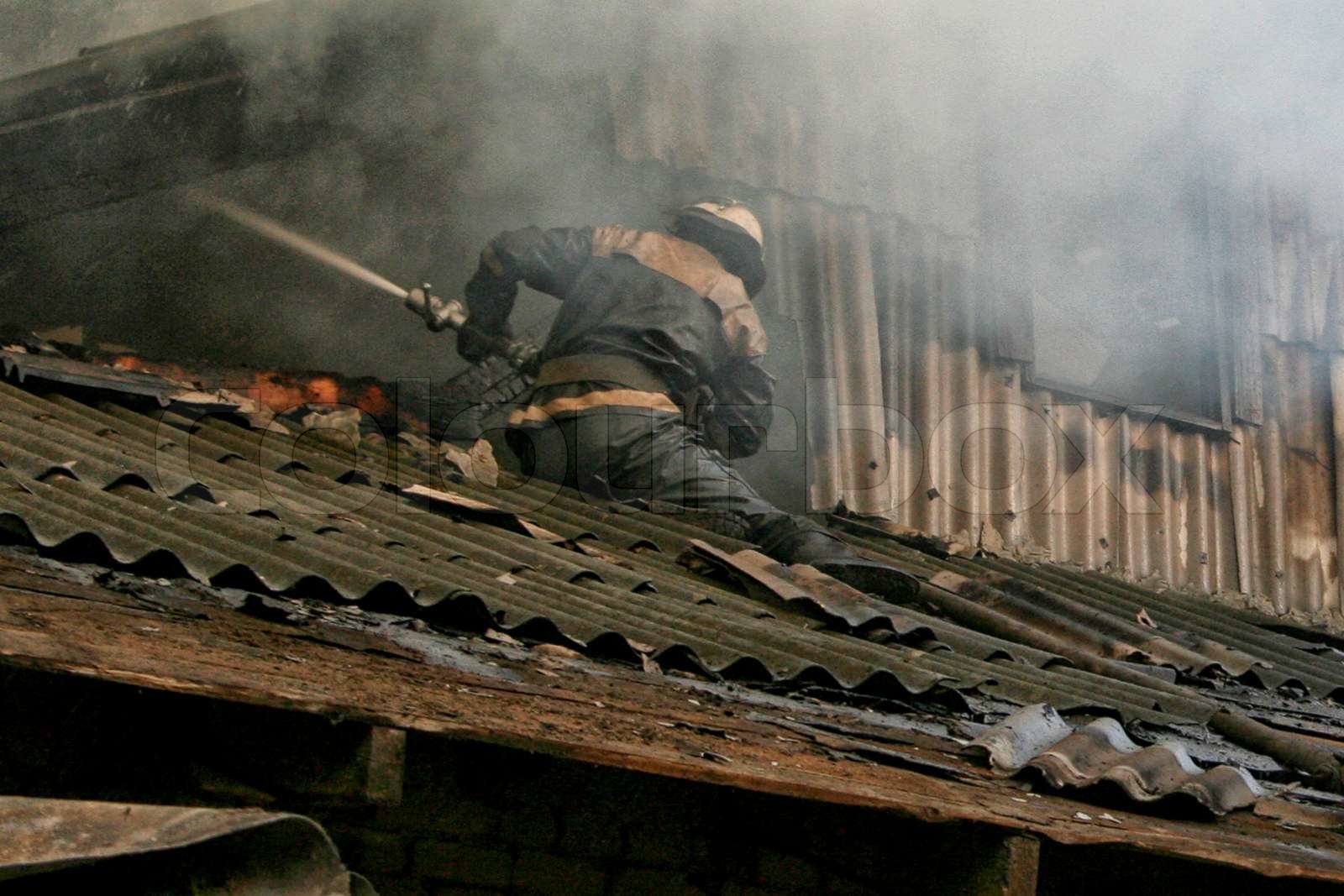 ireman spraying water | Stock image | Colourbox
