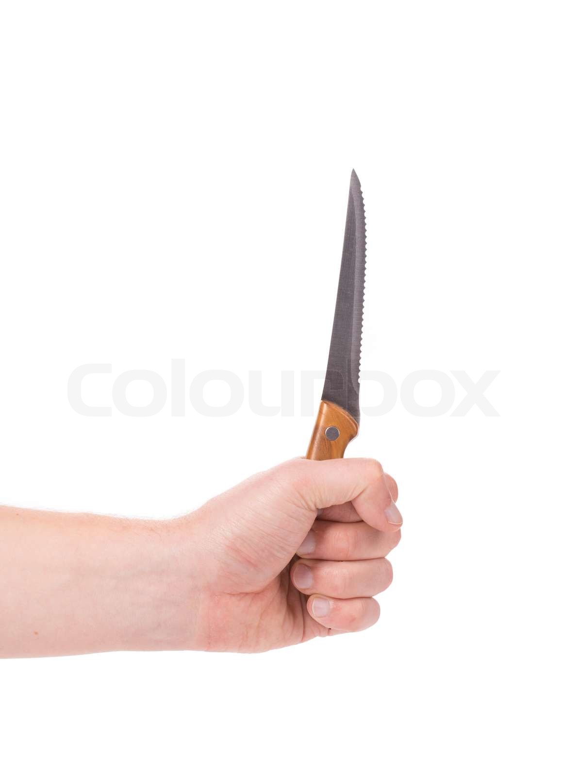 Hand holds knife. | Stock image | Colourbox