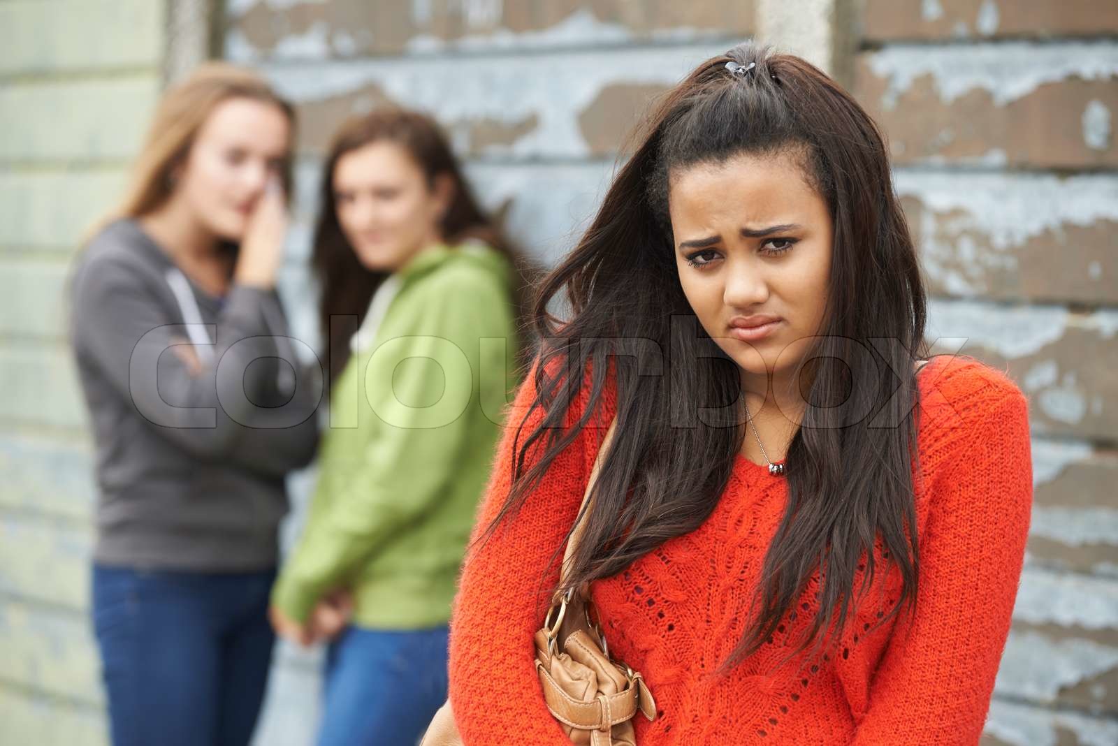 Unhappy Teenage Girl Being Gossiped About By Peers | Stock image ...