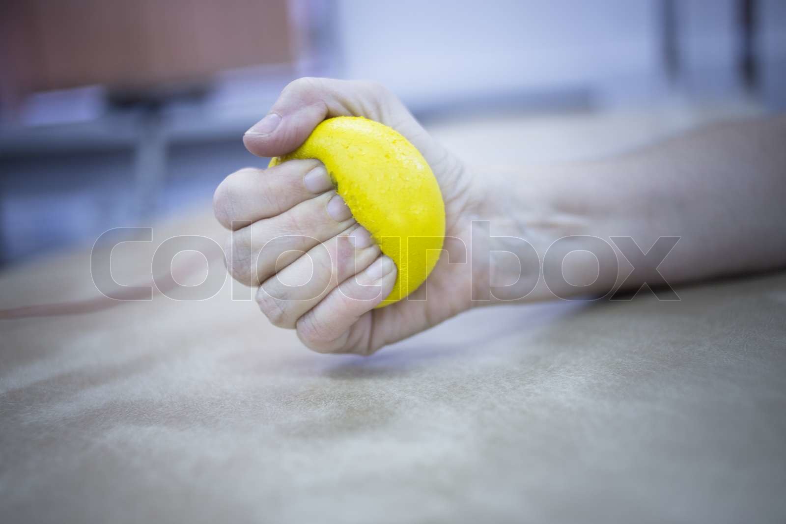 Patient hand squeezing physiotherapy ball | Stock image | Colourbox