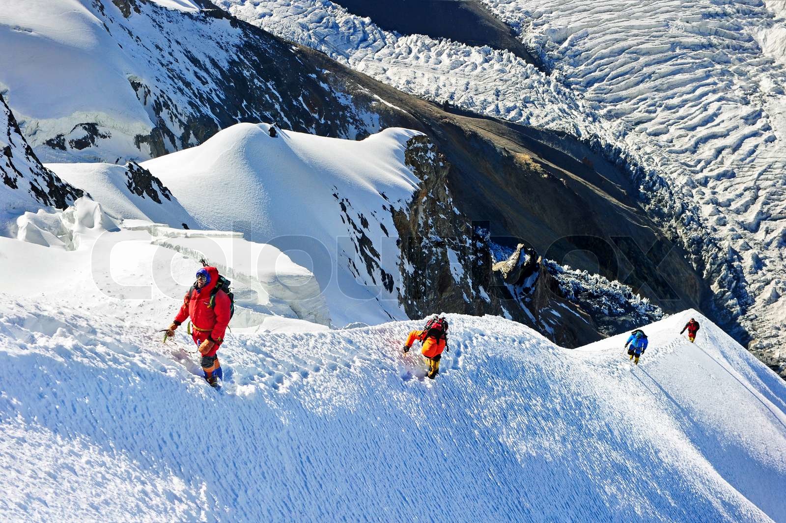 Group of climbers reaching the summit | Stock image | Colourbox