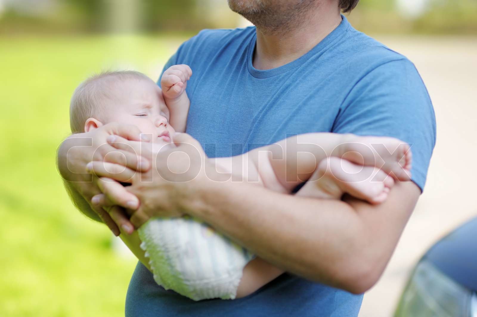 Man holding little baby boy | Stock image | Colourbox