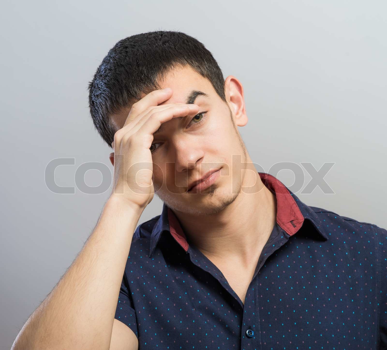 Portrait of Man Holding His Head in Stress | Stock image | Colourbox