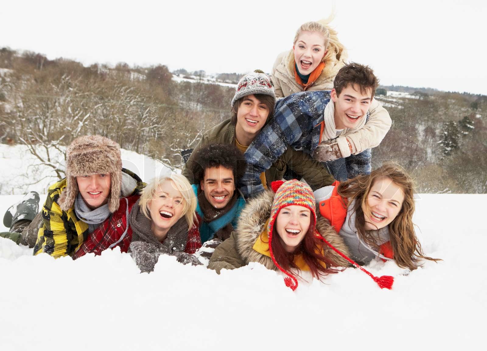 Teens In Snow Fun