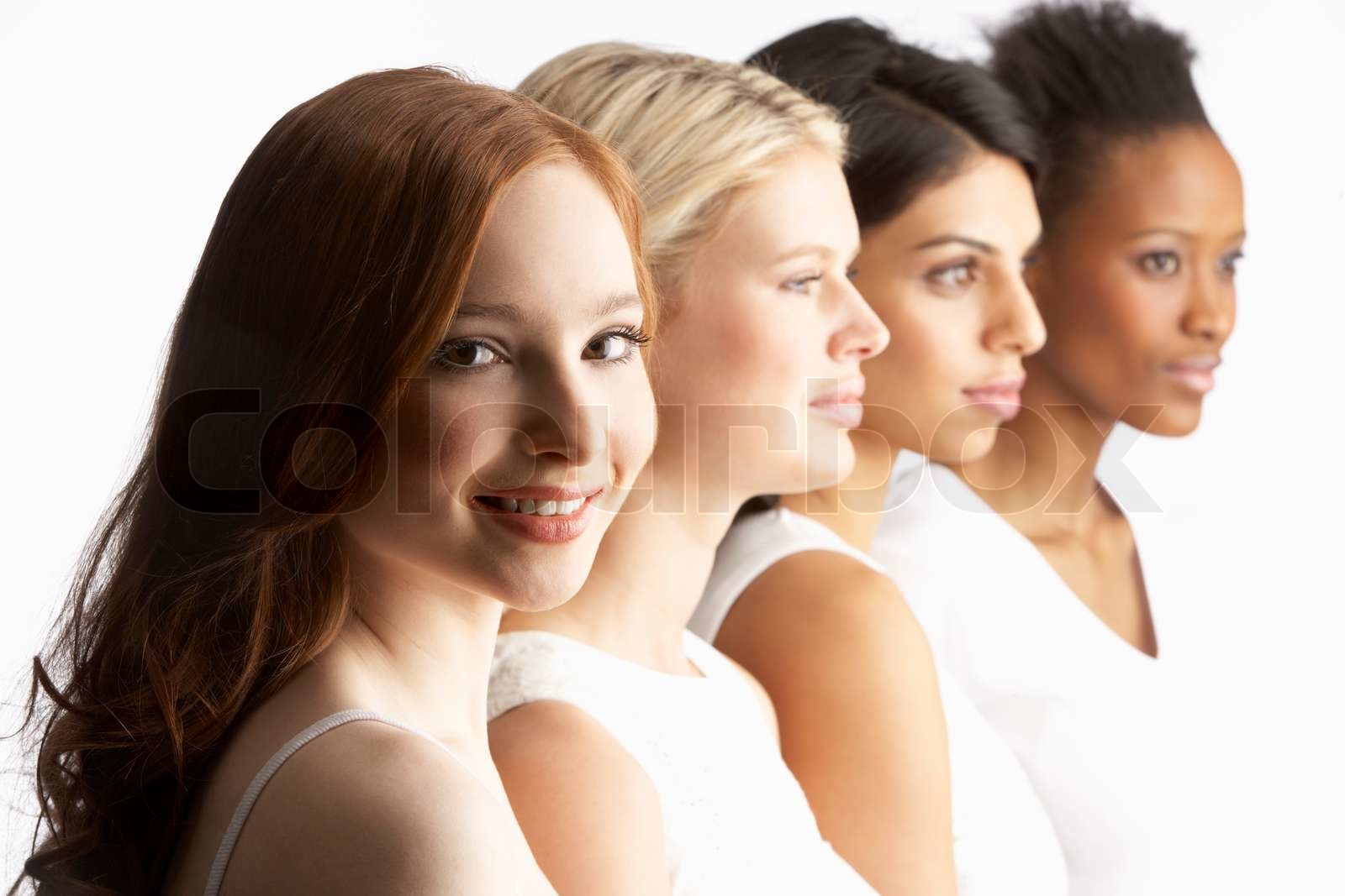 Portrait Of Four Attractive Young Women In Studio Standing In Line ...