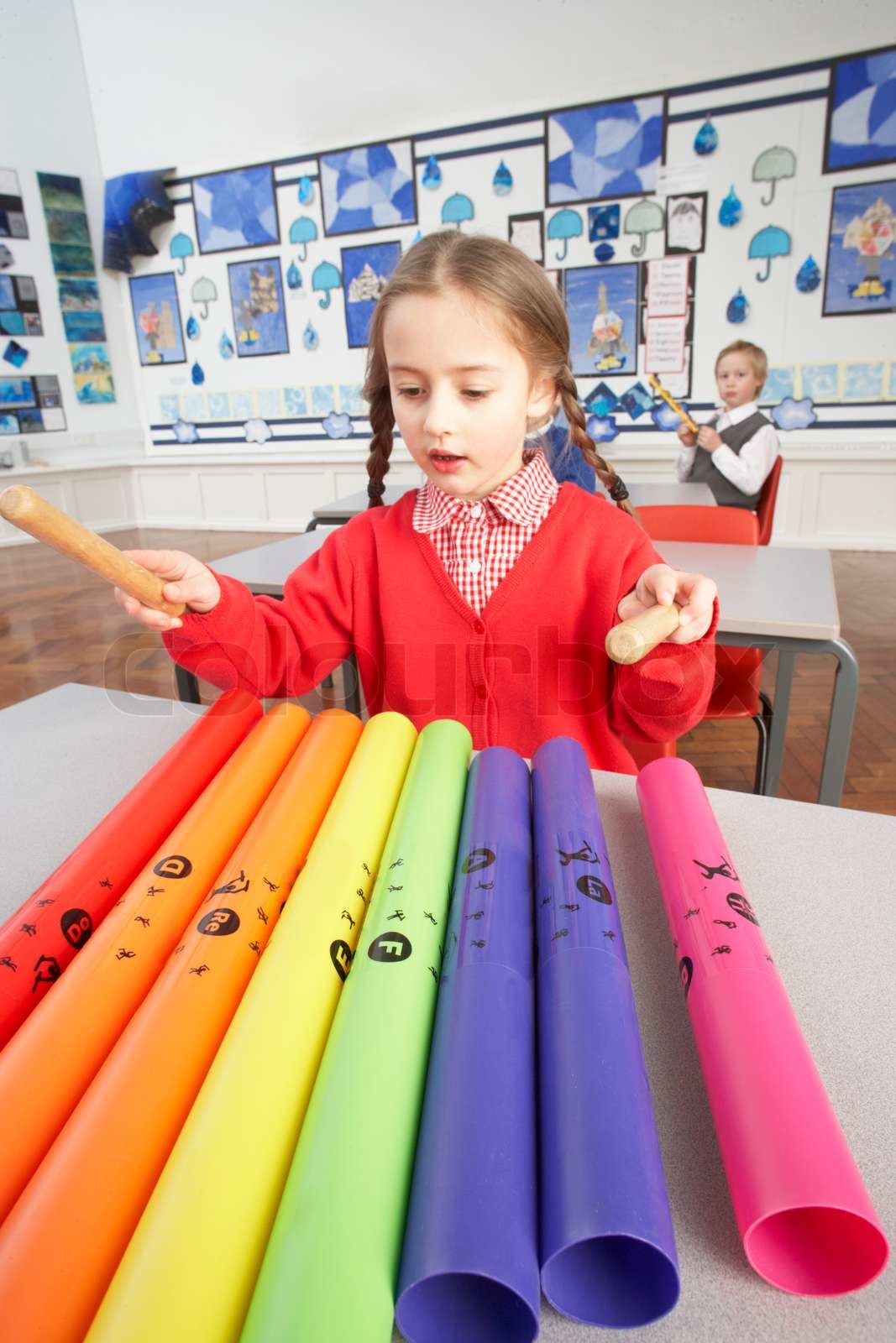 Group Of Primary Schoolchildren Having Music Lesson In Classroom ...