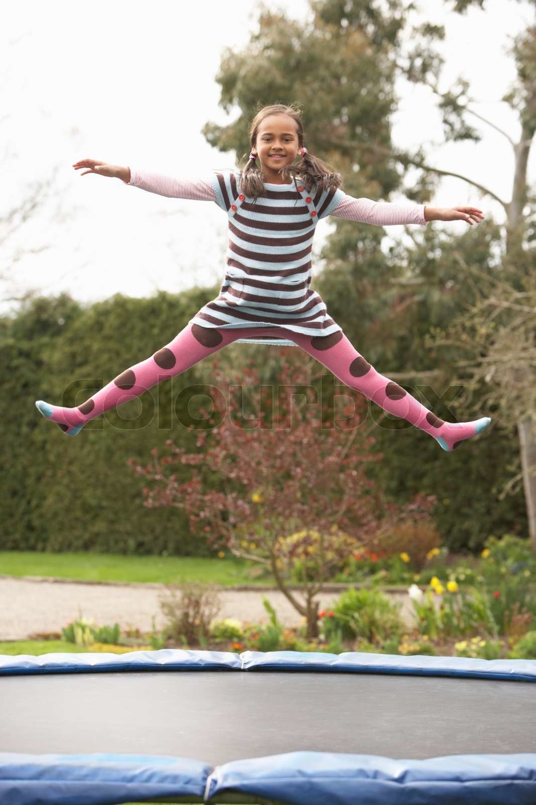 Girl Playing On Trampoline | Stock image | Colourbox
