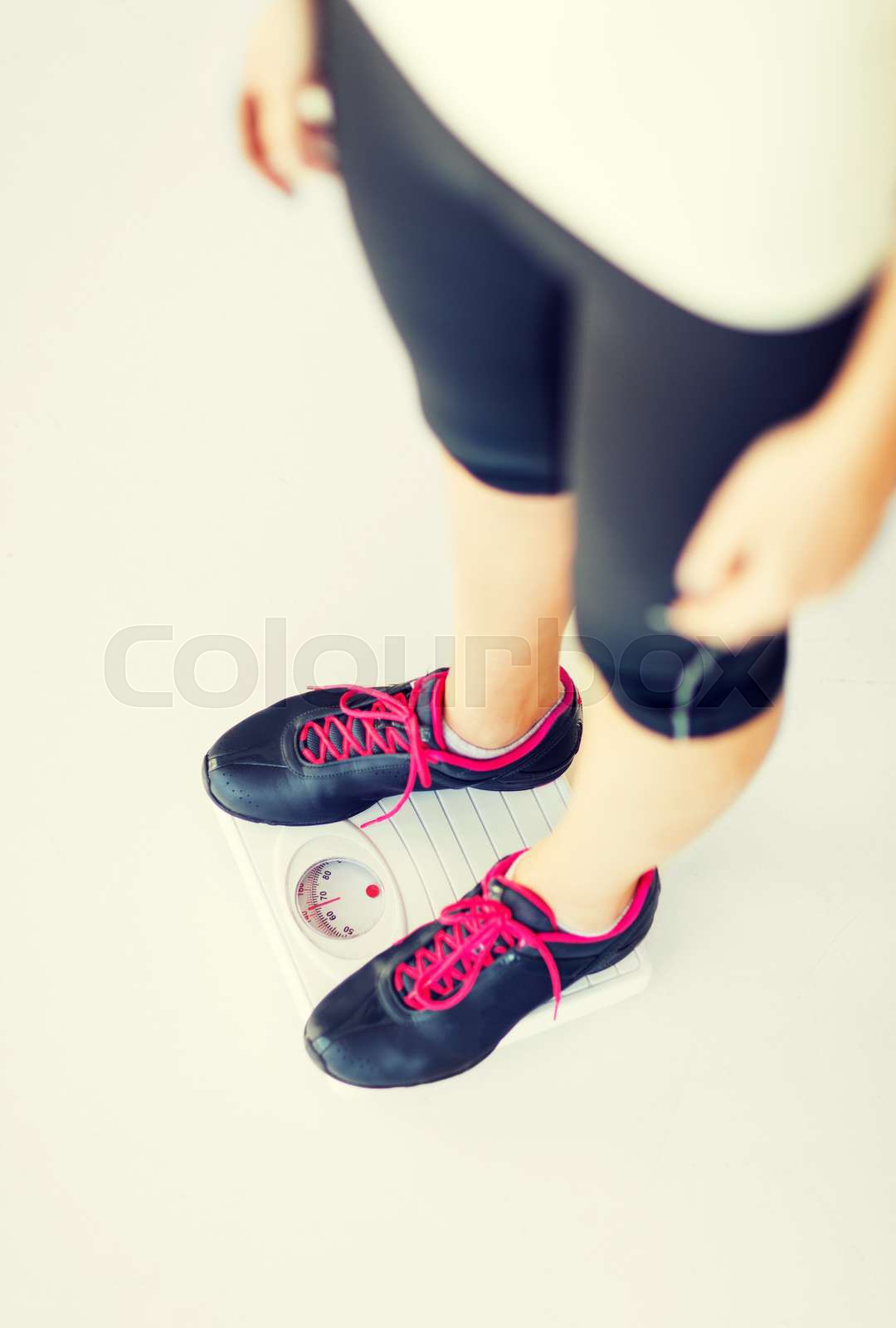 woman legs standing on scales | Stock image | Colourbox