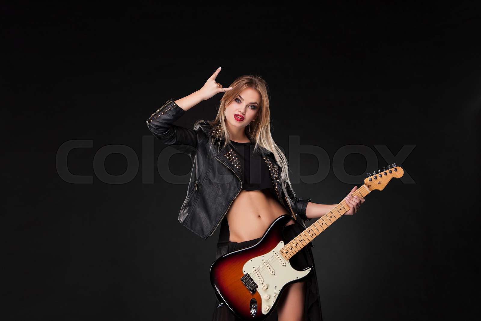 Beautiful girl playing guitar | Stock image | Colourbox