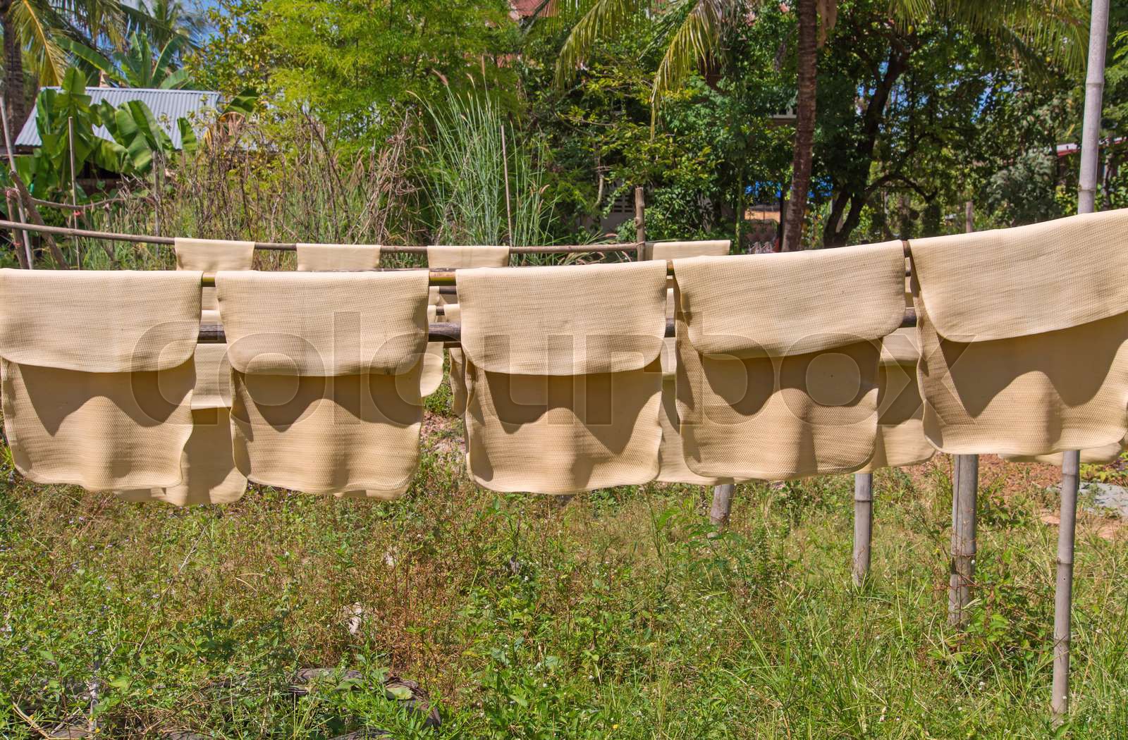 process of dry raw rubber sheets in the sun | Stock image | Colourbox