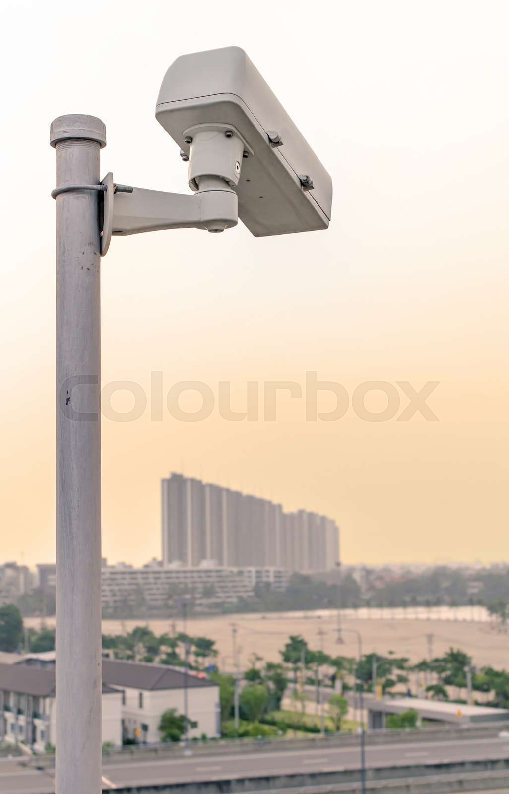 Security CCTV camera on road in city | Stock image | Colourbox