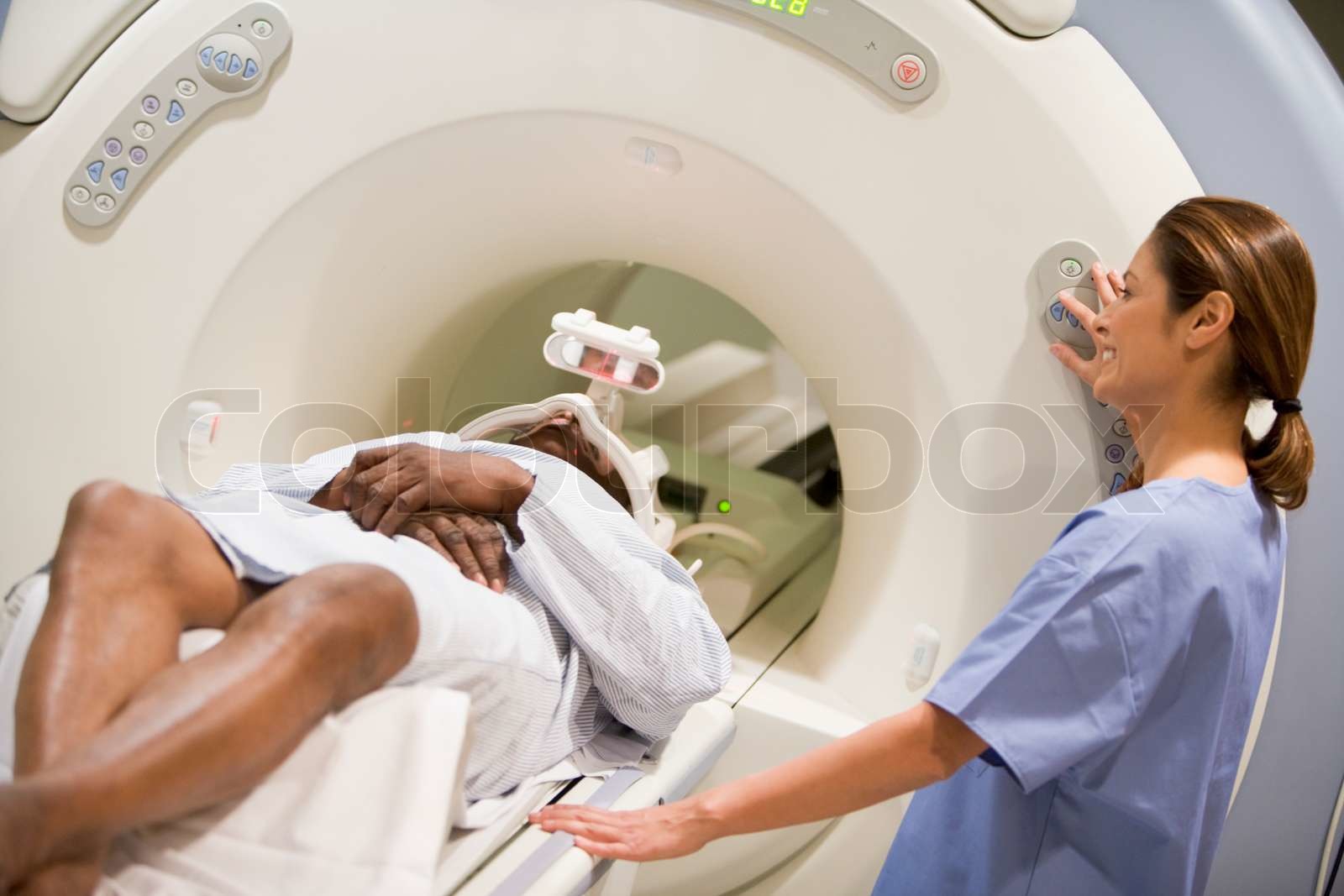 Nurse With Patient As They Prepare For A Computerized Axial Tomography ...