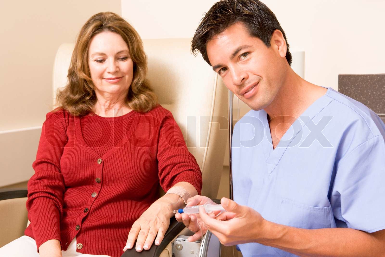 Nurse Giving Patient An Injection | Stock image | Colourbox