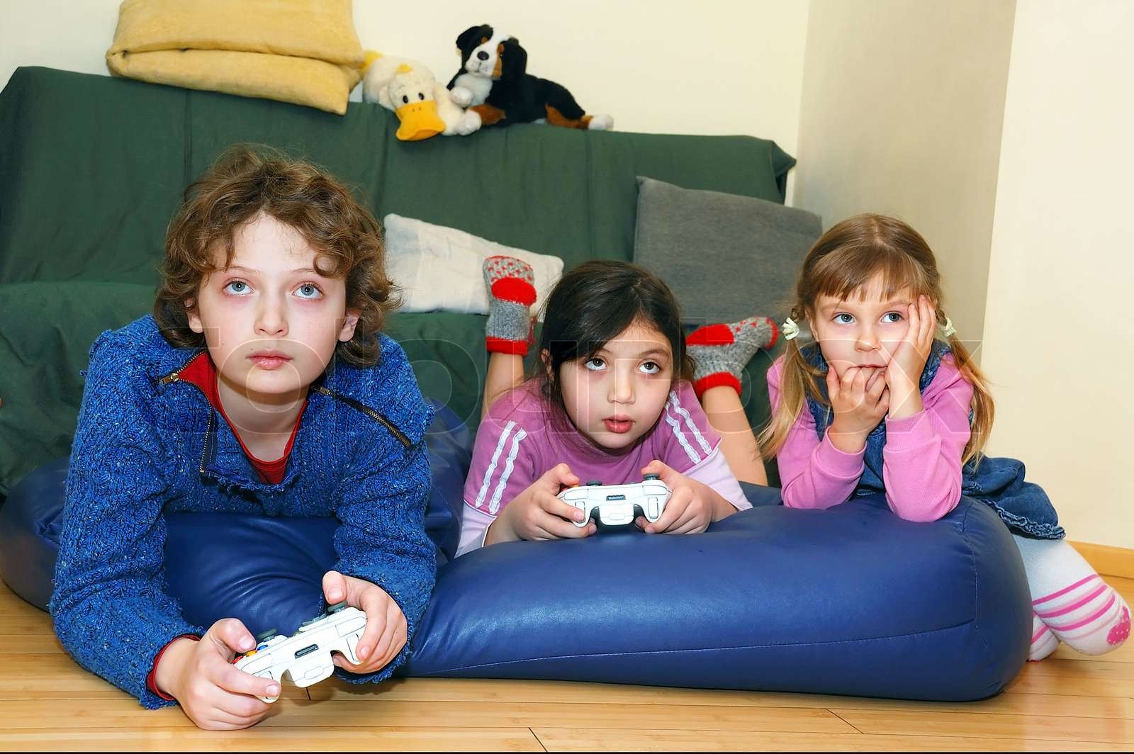 group of kids playing a video game | Stock image | Colourbox