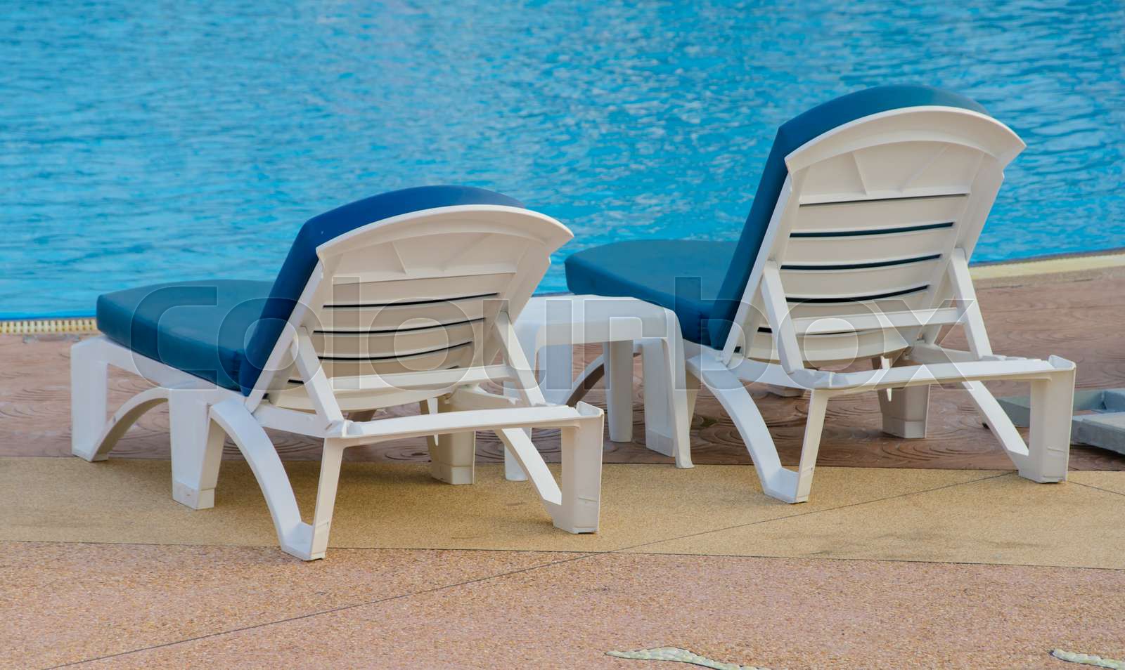 Beach chairs near swimming pool | Stock image | Colourbox