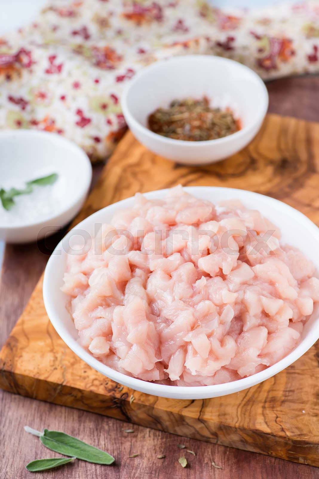 Fresh raw chopped chicken meat in a bowl | Stock image | Colourbox