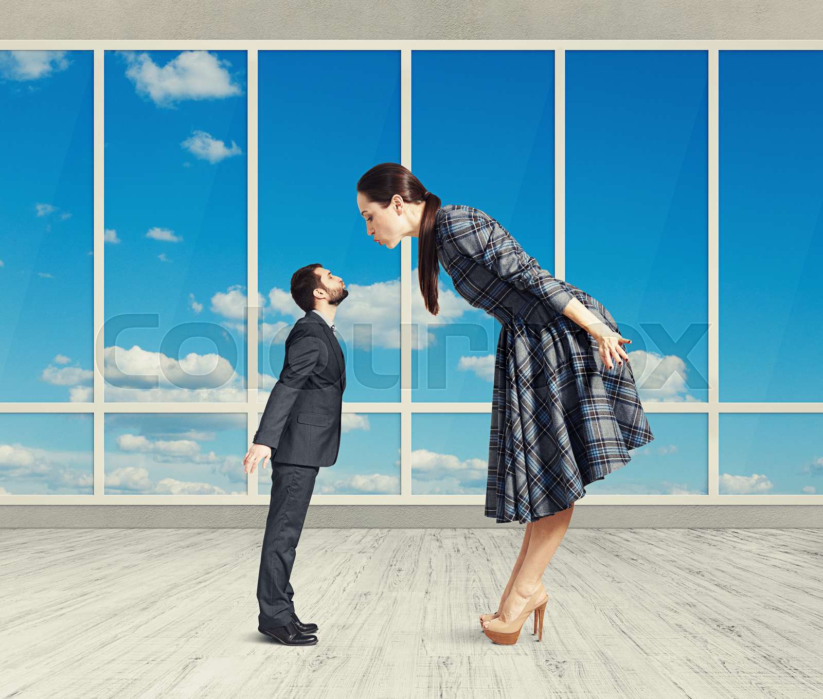 woman bending forward and kissing | Stock image | Colourbox