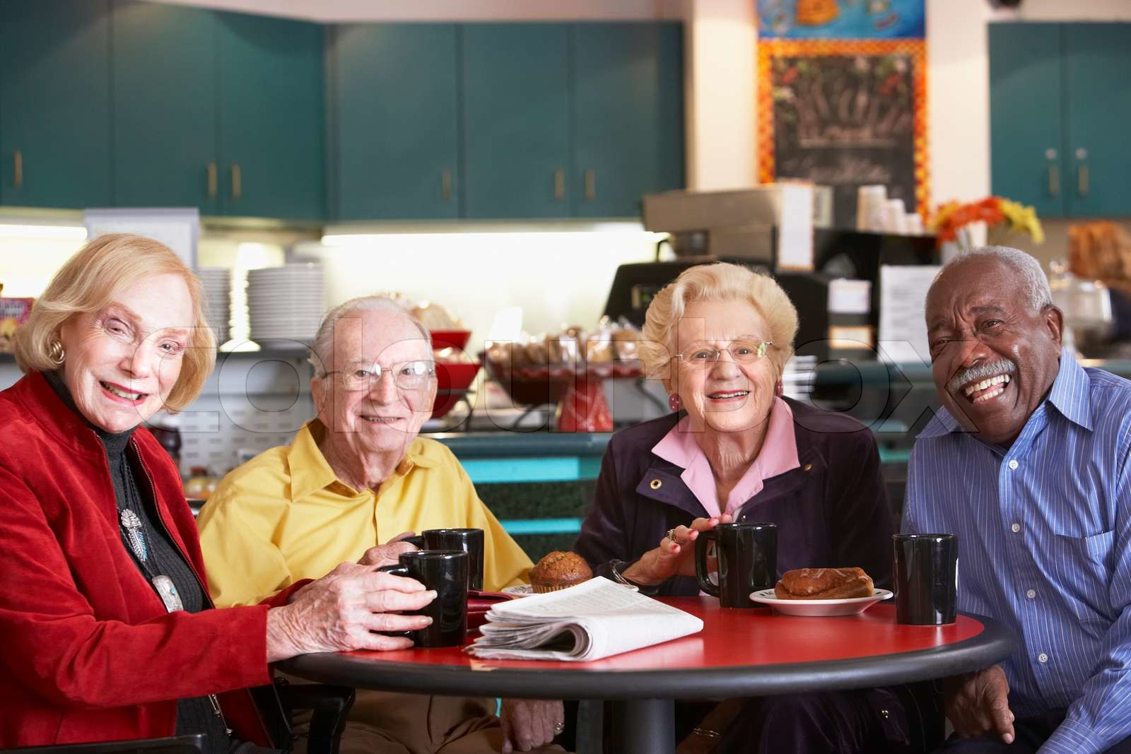 Senior adults having morning tea together | Stock image | Colourbox
