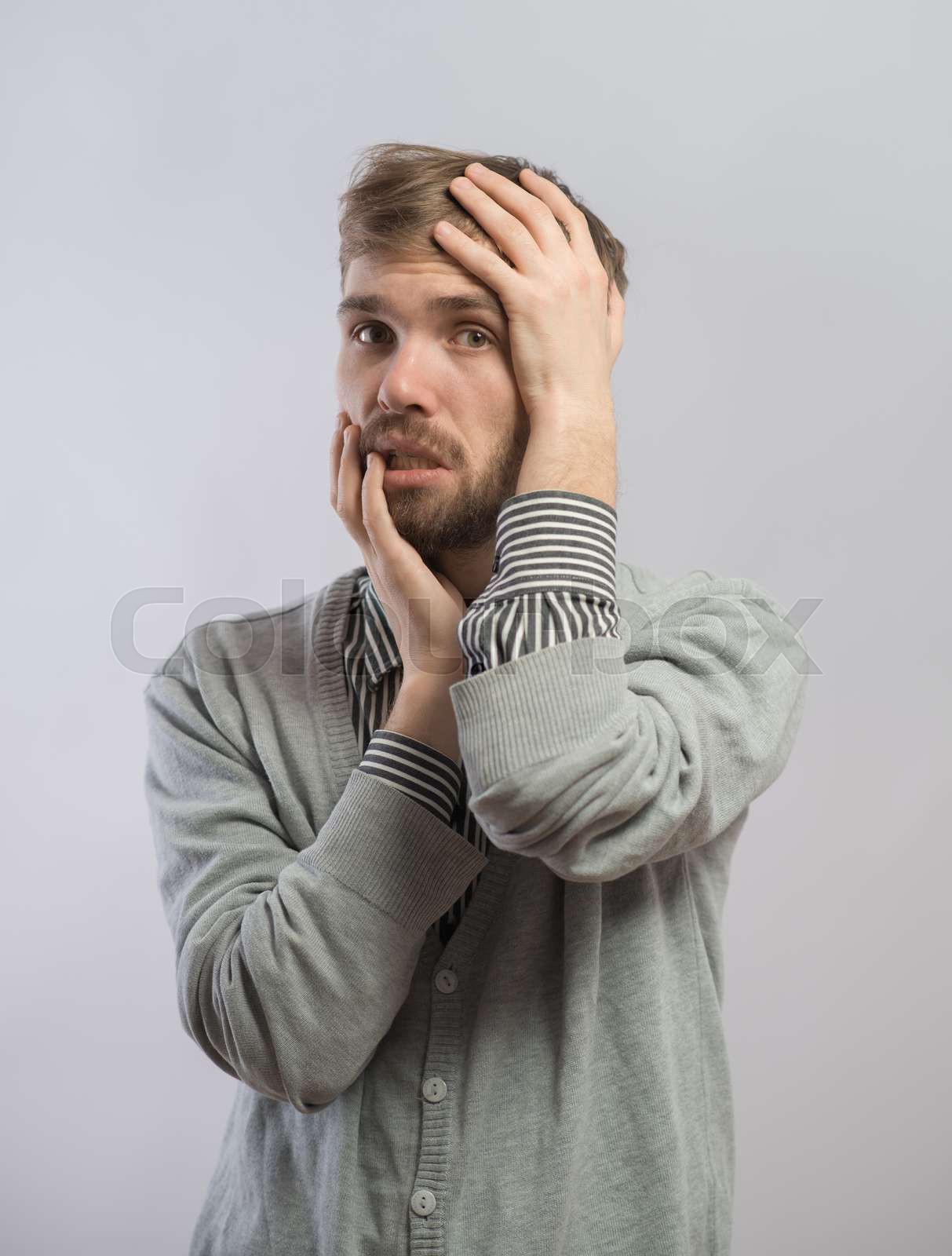 Young man looking scared | Stock image | Colourbox