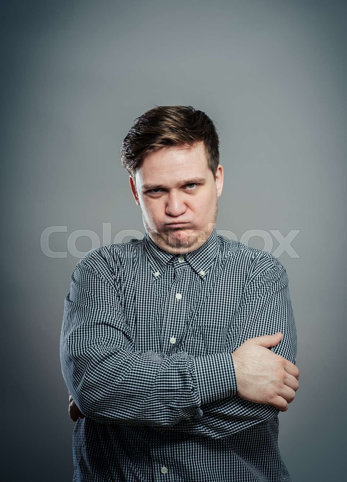 Portrait of disgusted man looking at the camera | Stock image | Colourbox