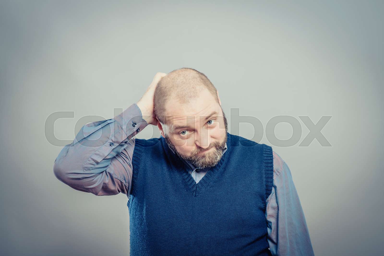 Portrait of a confused male individual with hand in hair | Stock image ...