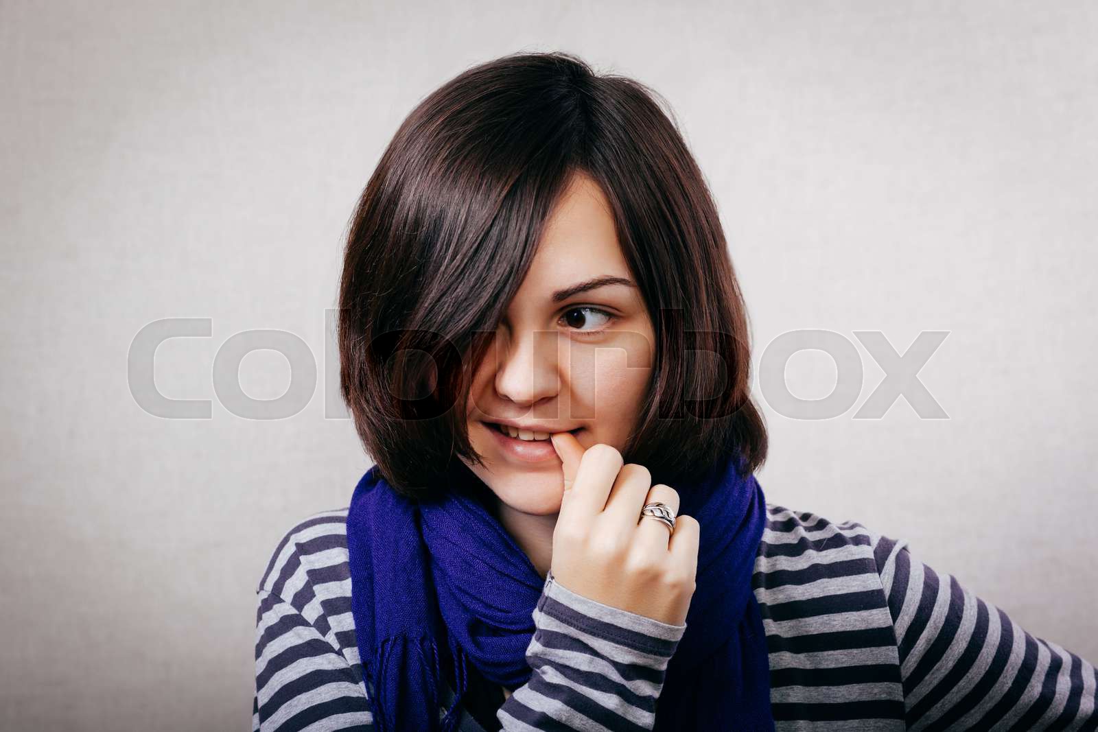 Girl is very nervous because bitten nails | Stock image | Colourbox