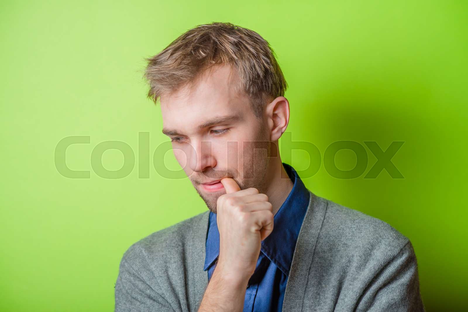 Closeup Portrait Of Thinking Man With Finger In Mouth Sucking Thumb closeup-portrait-of-thinking-man-with-finger-in-mouth-sucking-thumb
