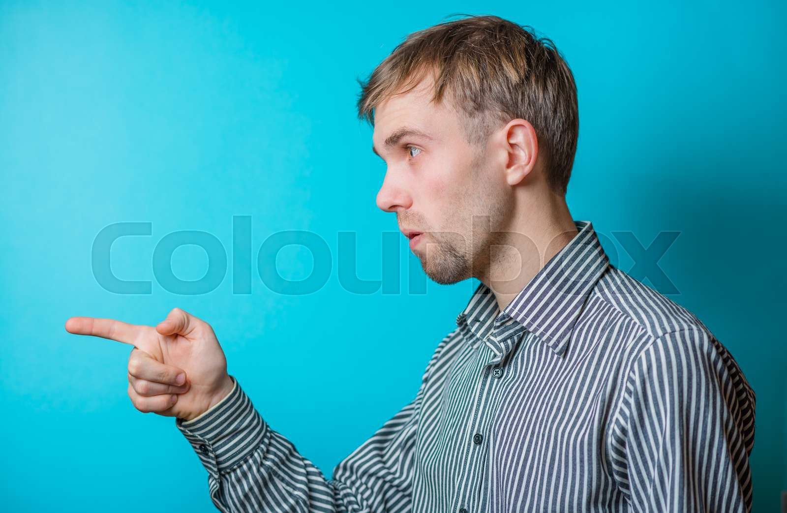 Young man . Show someone the finger. Gesture. Photo Shoot. | Stock ...