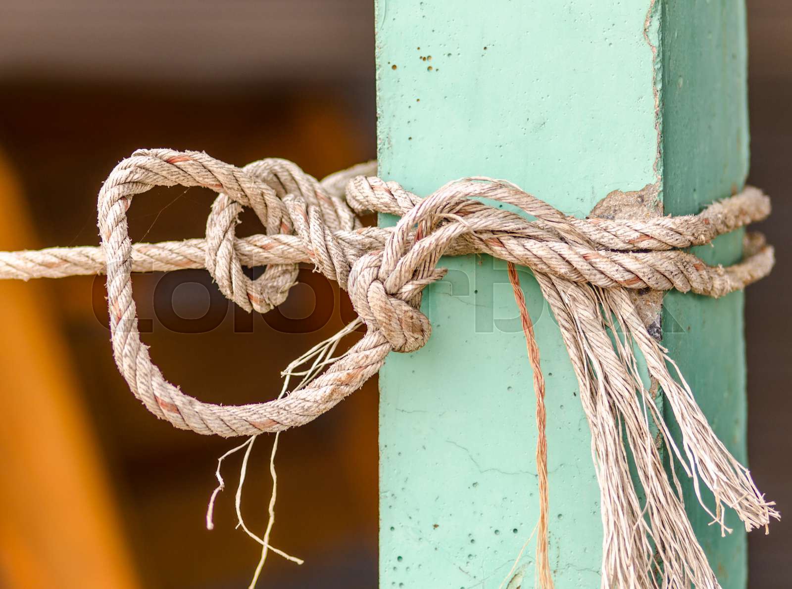 The rope tying with pole mortar | Stock image | Colourbox