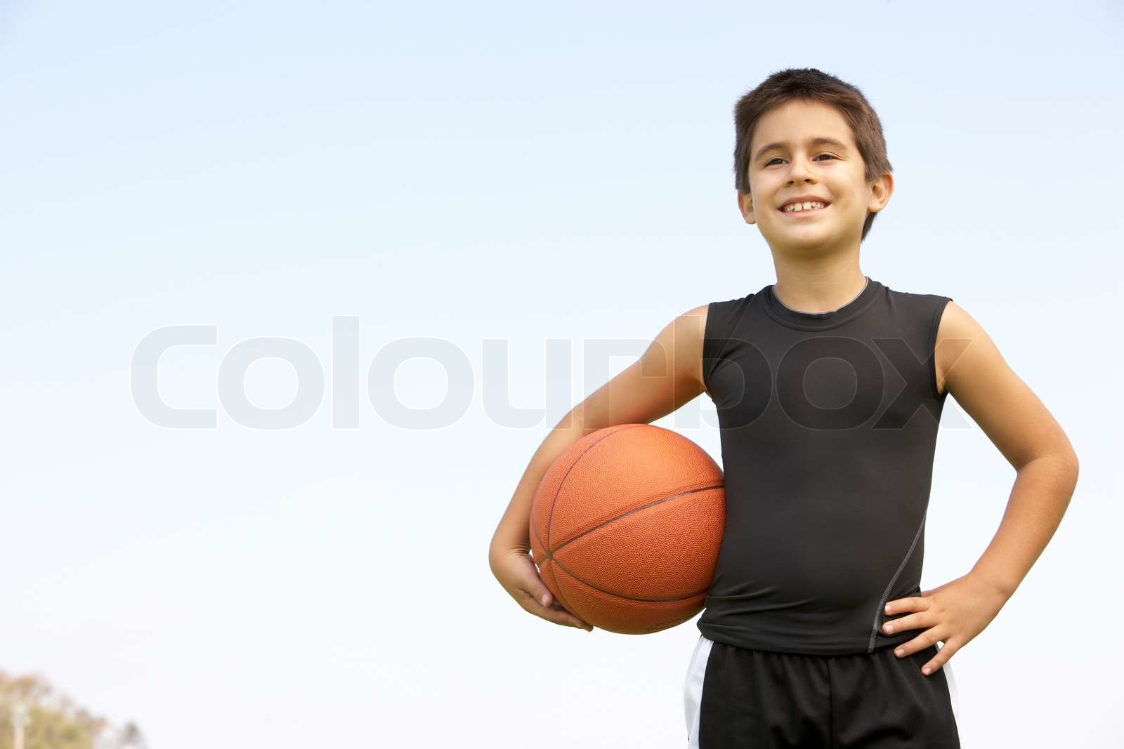 Young Boy Playing Basketball | Stock image | Colourbox