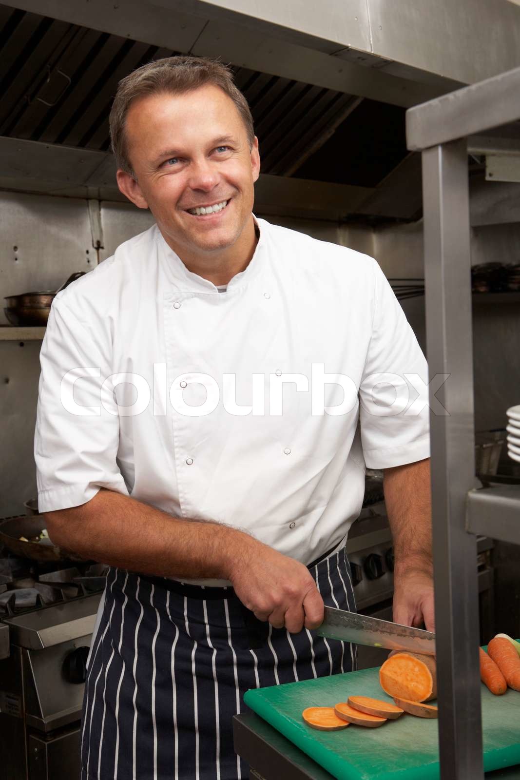 Male Chef Preparing Vegetables In Restaurant Kitchen | Stock image ...