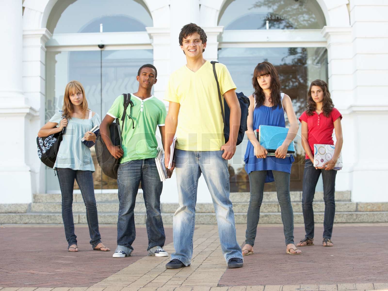 Group Of Teenage Students Standing Outside College Building | Stock ...