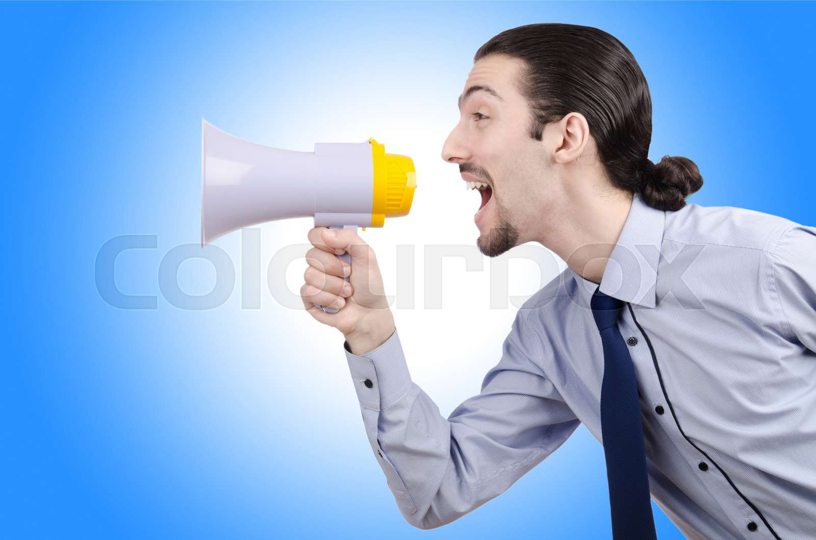 Man shouting and yelling with loudspeaker | Stock image | Colourbox