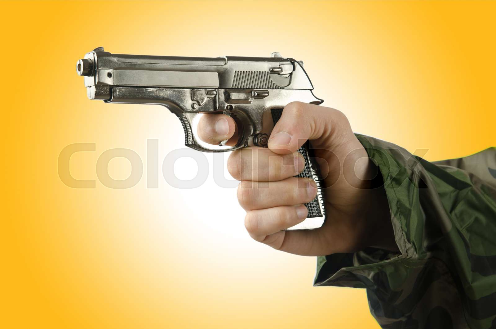 Gun in the hand on white | Stock image | Colourbox