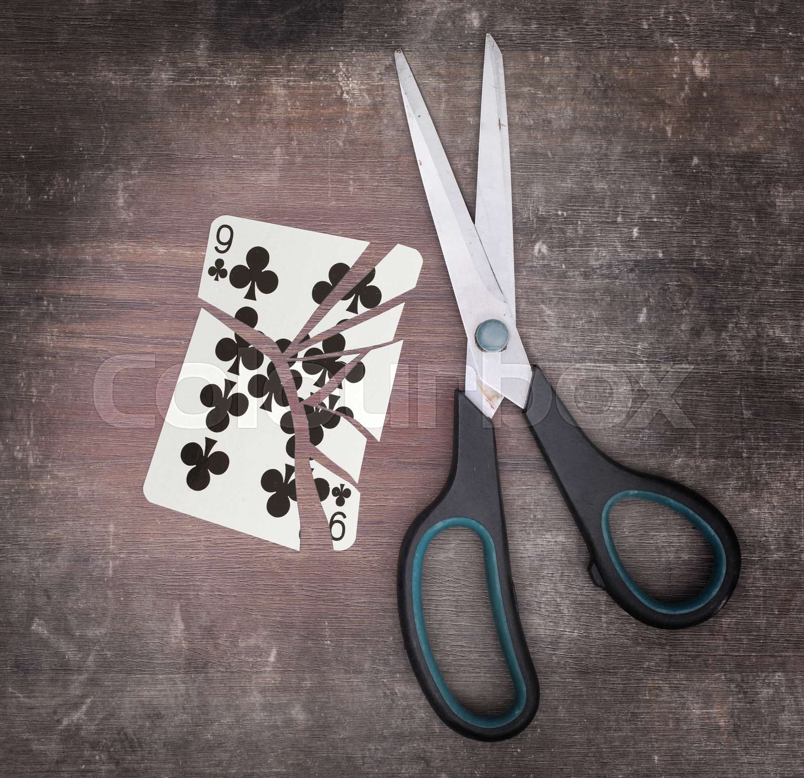 Concept of addiction, card with scissors | Stock image | Colourbox