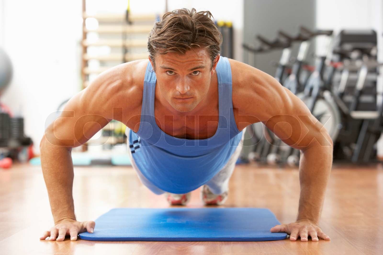 Man Doing Press Ups In Gym | Stock image | Colourbox