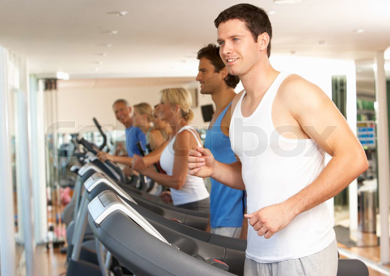 Man On Running Machine Im Gym | Stock Bild | Colourbox