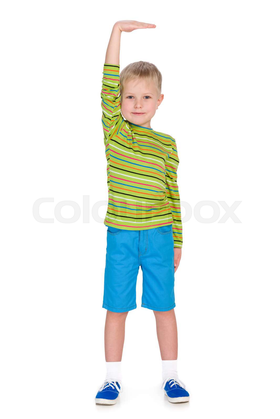 Young boy shows how he is tall | Stock image | Colourbox