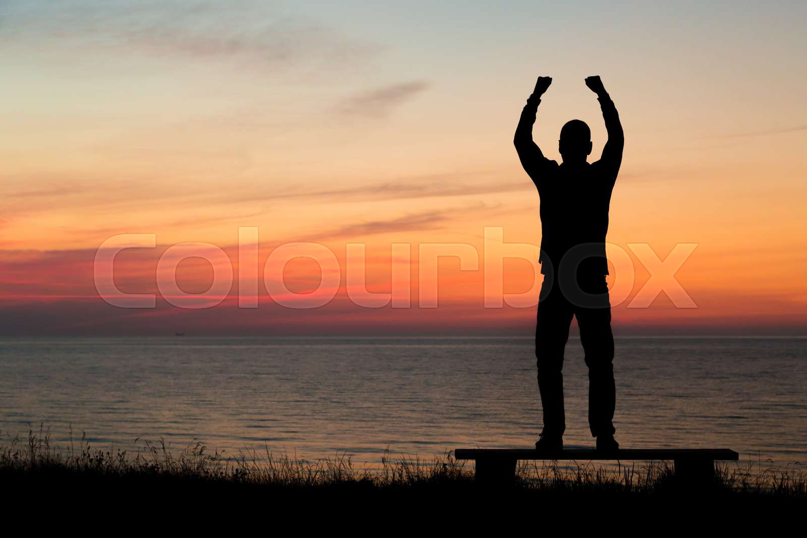 Man with raised arms | Stock image | Colourbox