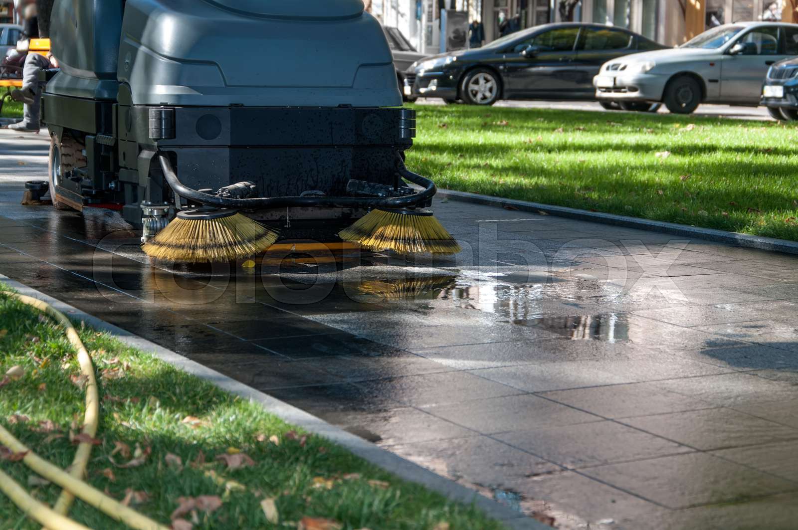 process of cleaning walkways in the Park machine | Stock image | Colourbox