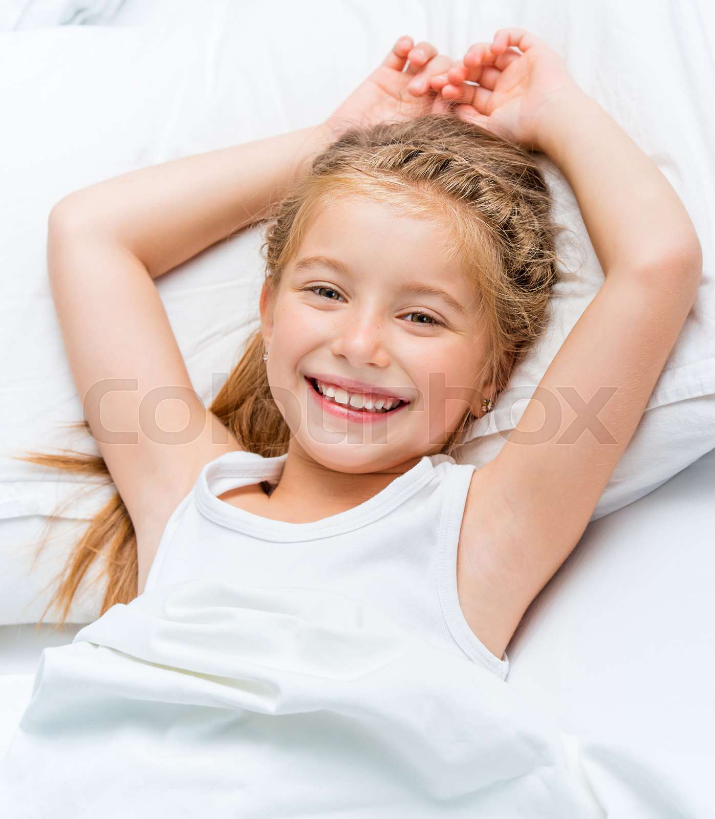 smiling little girl woke up | Stock image | Colourbox