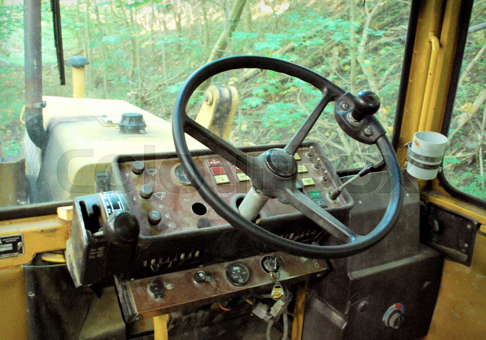 Looking inside a Backhoe loader | Stock image | Colourbox