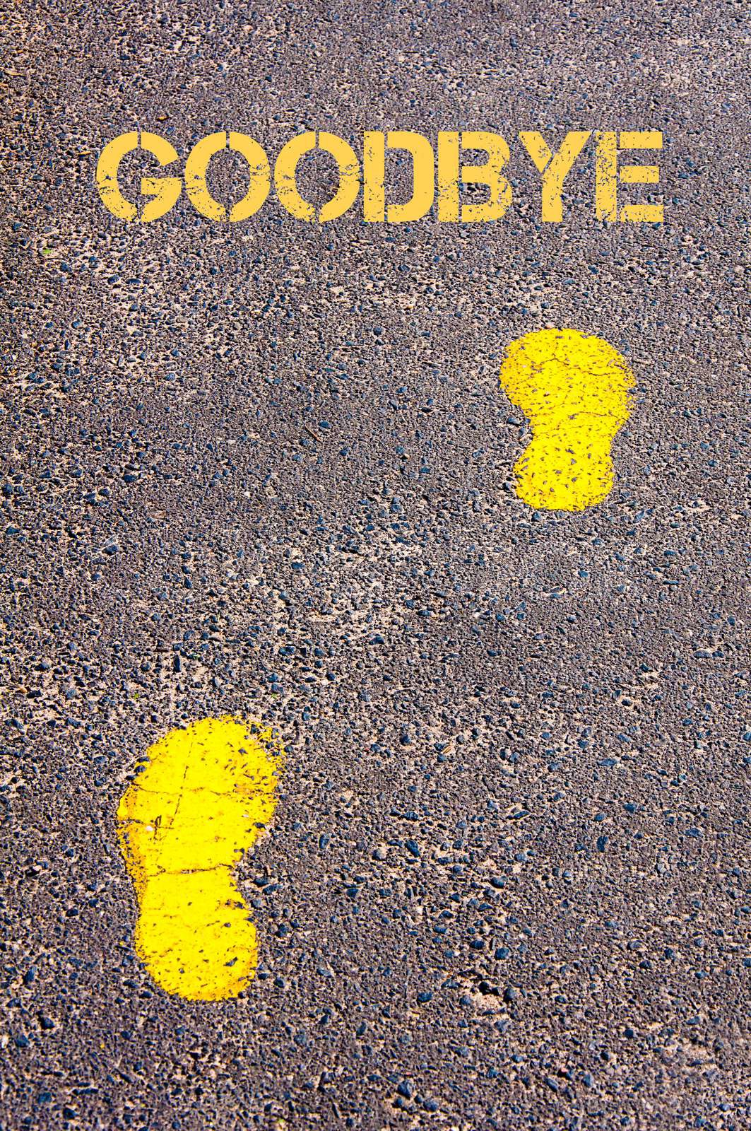 Yellow footsteps on sidewalk towards Goodbye message | Stock image ...