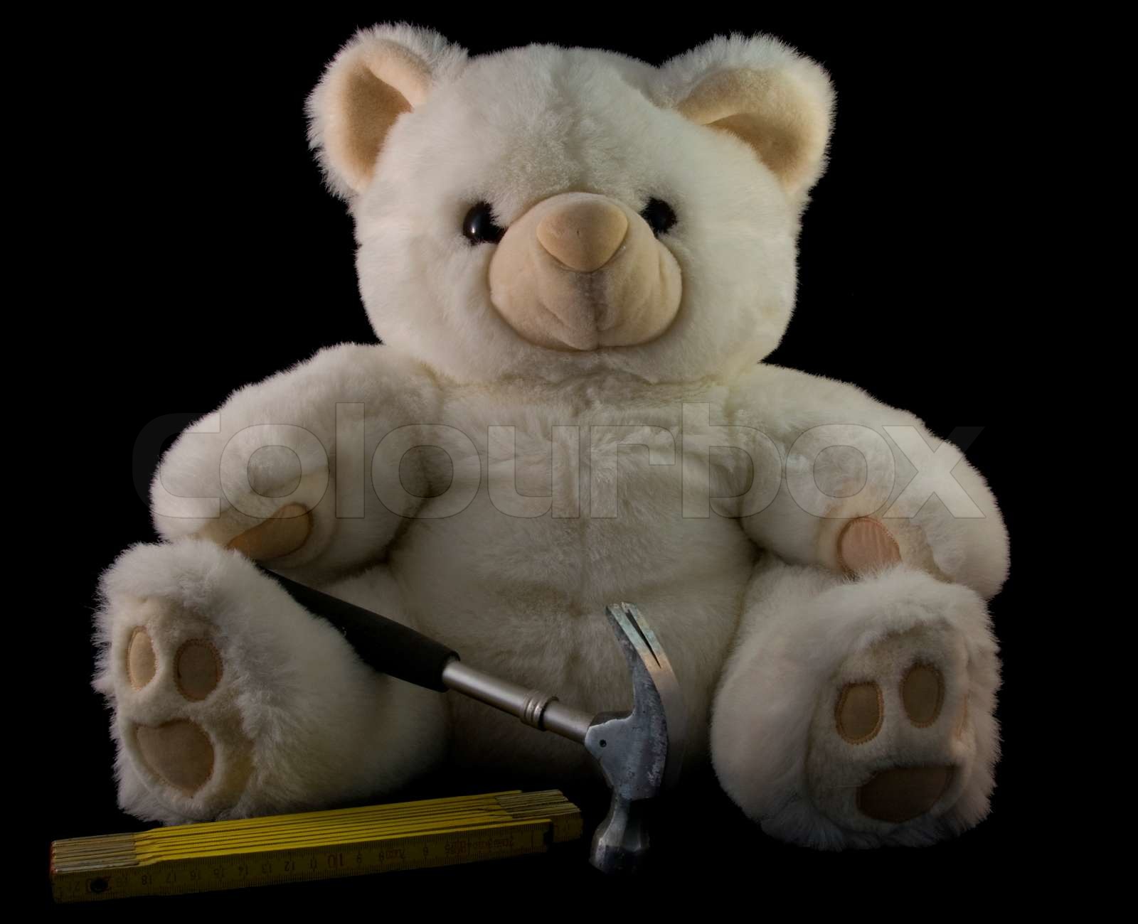 teddy bear in white with tools as a hammer and a ruler | Stock image ...