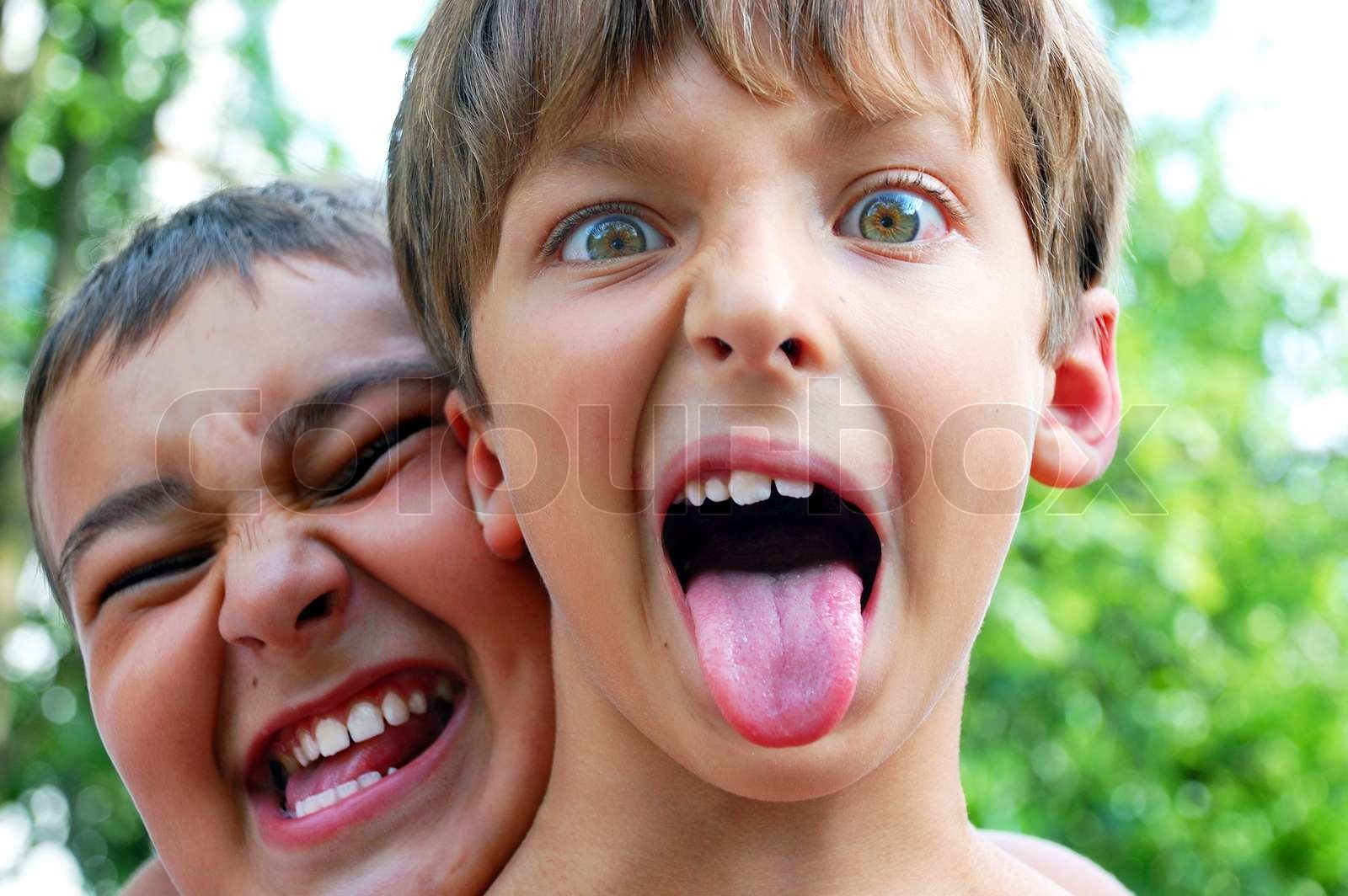 two cute boys making crazy faces outdoor | Stock image | Colourbox