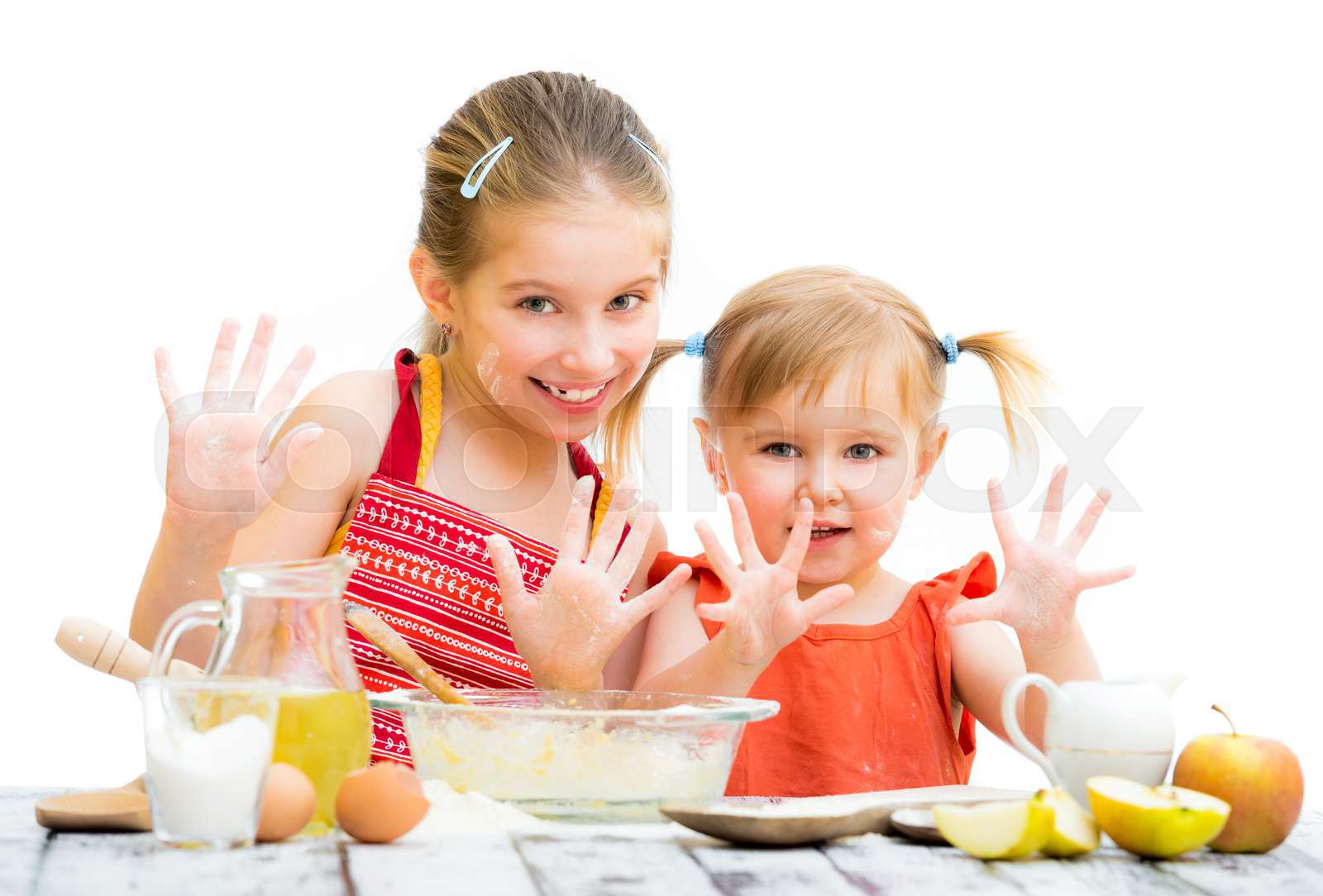 cute little sisters baking on kitchen | Stock image | Colourbox