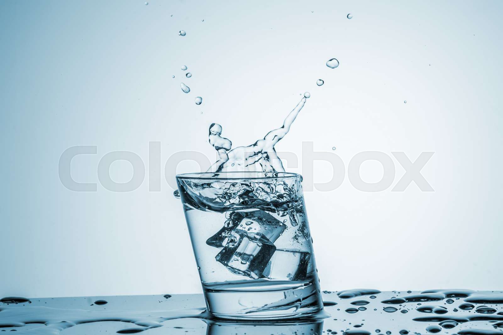 Water in glass with water splash | Stock image | Colourbox
