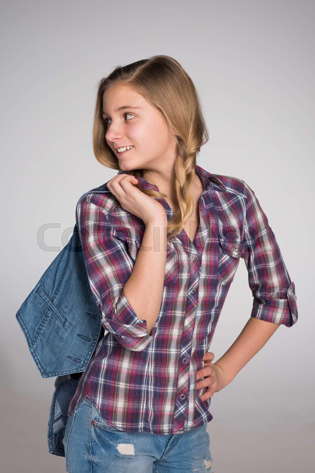 Adorable teen girl looks back | Stock image | Colourbox